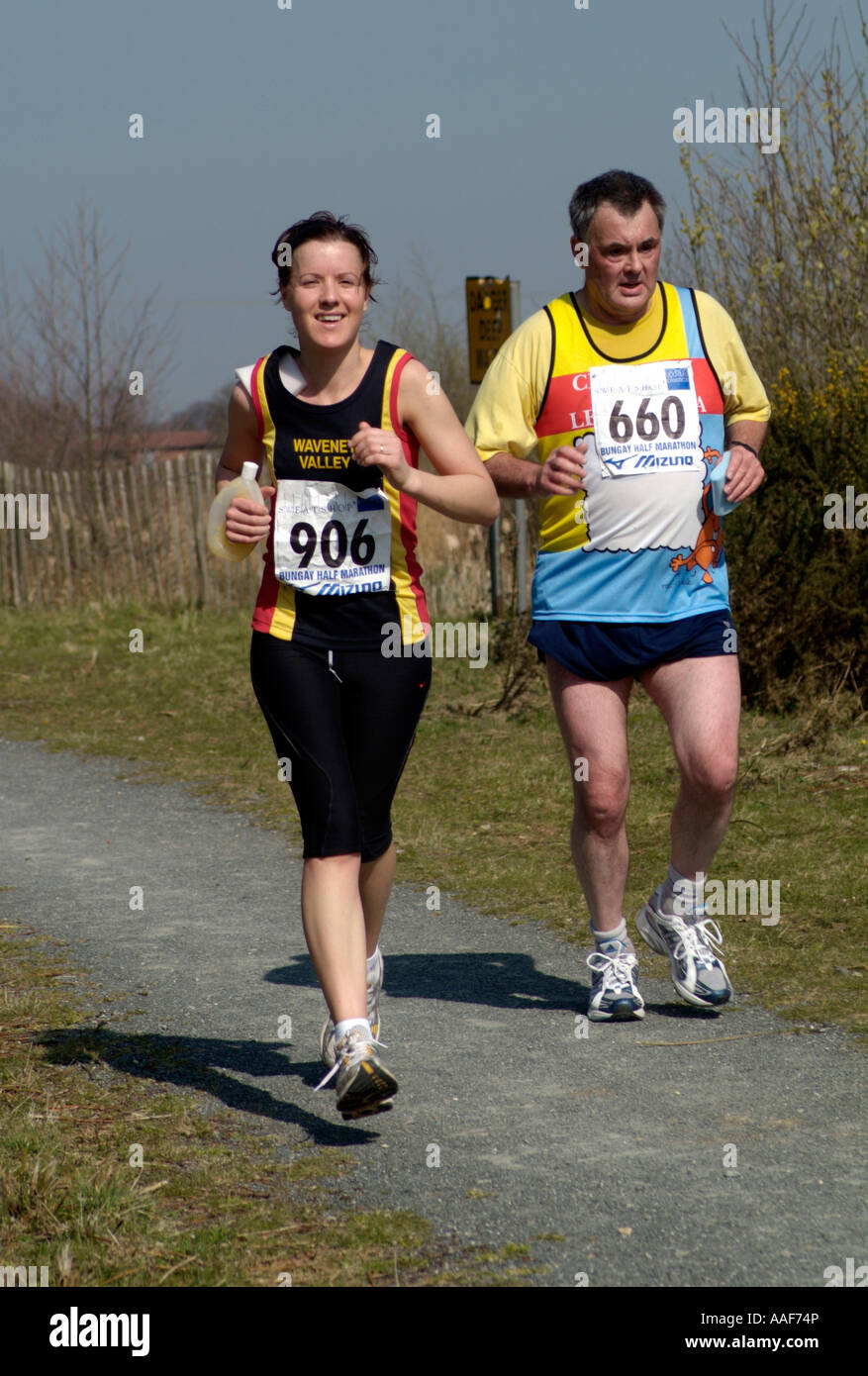young women beating older man in running race Stock Photo - Alamy