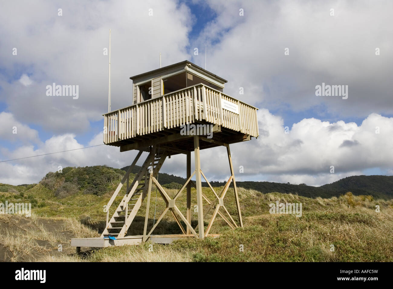 Wooden lifeguard lookout post Tiha beach at low tide Waitakere Ranges ...