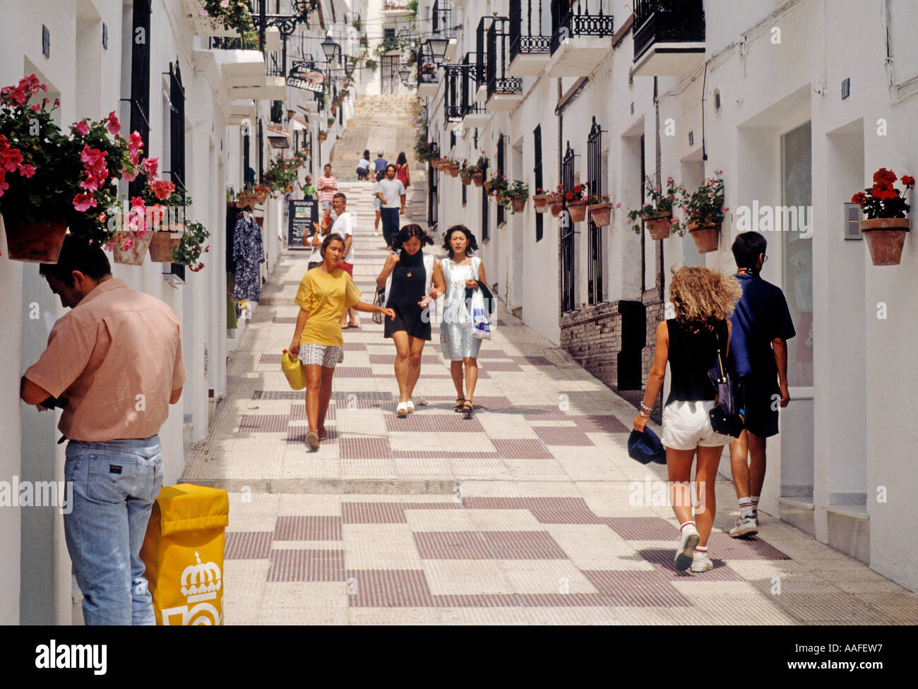 typical street of san sebastian in the white village of mijas malaga ...