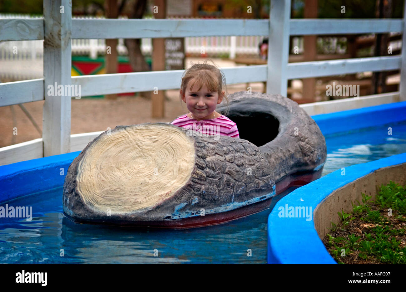 Girl on log flume ride Stock Photo - Alamy