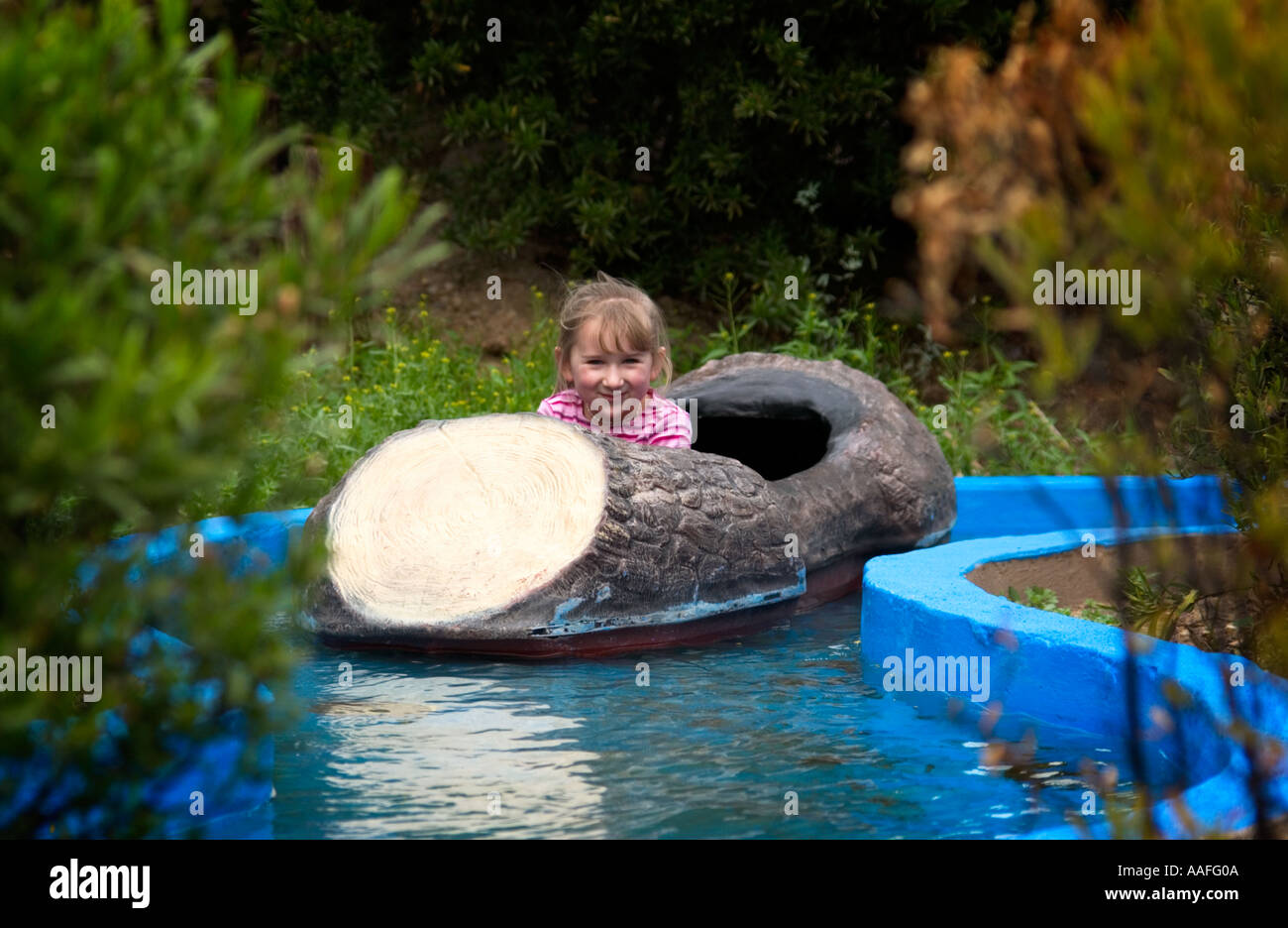 Girl on log flume ride Stock Photo - Alamy