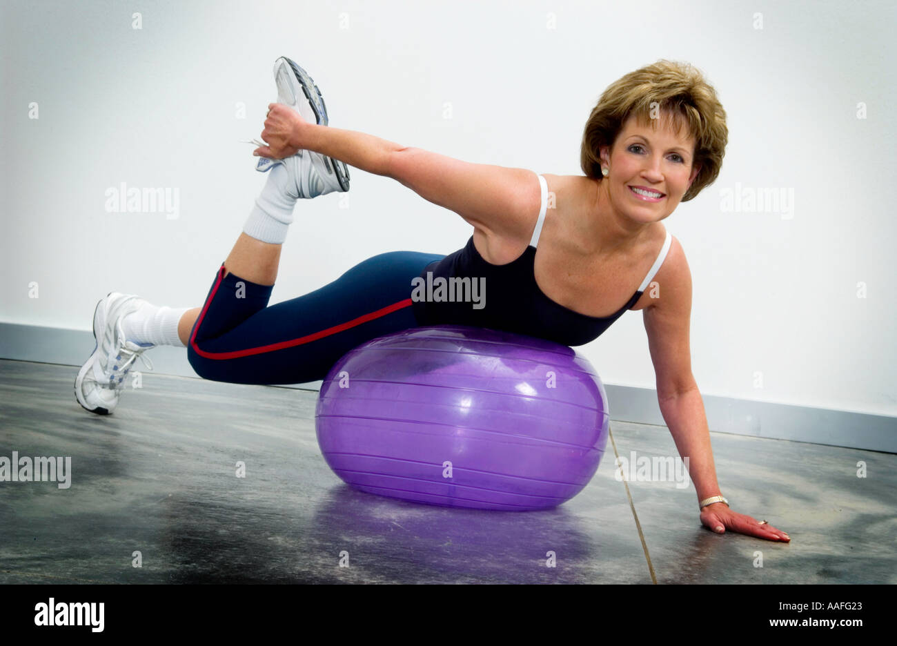 Woman using exercise ball Stock Photo - Alamy