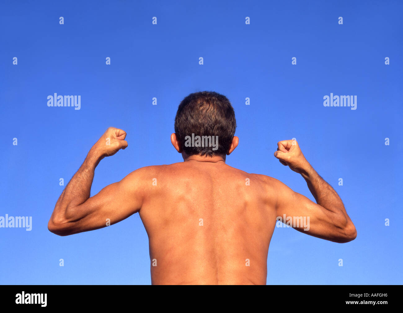 senior man flexing muscles Stock Photo - Alamy