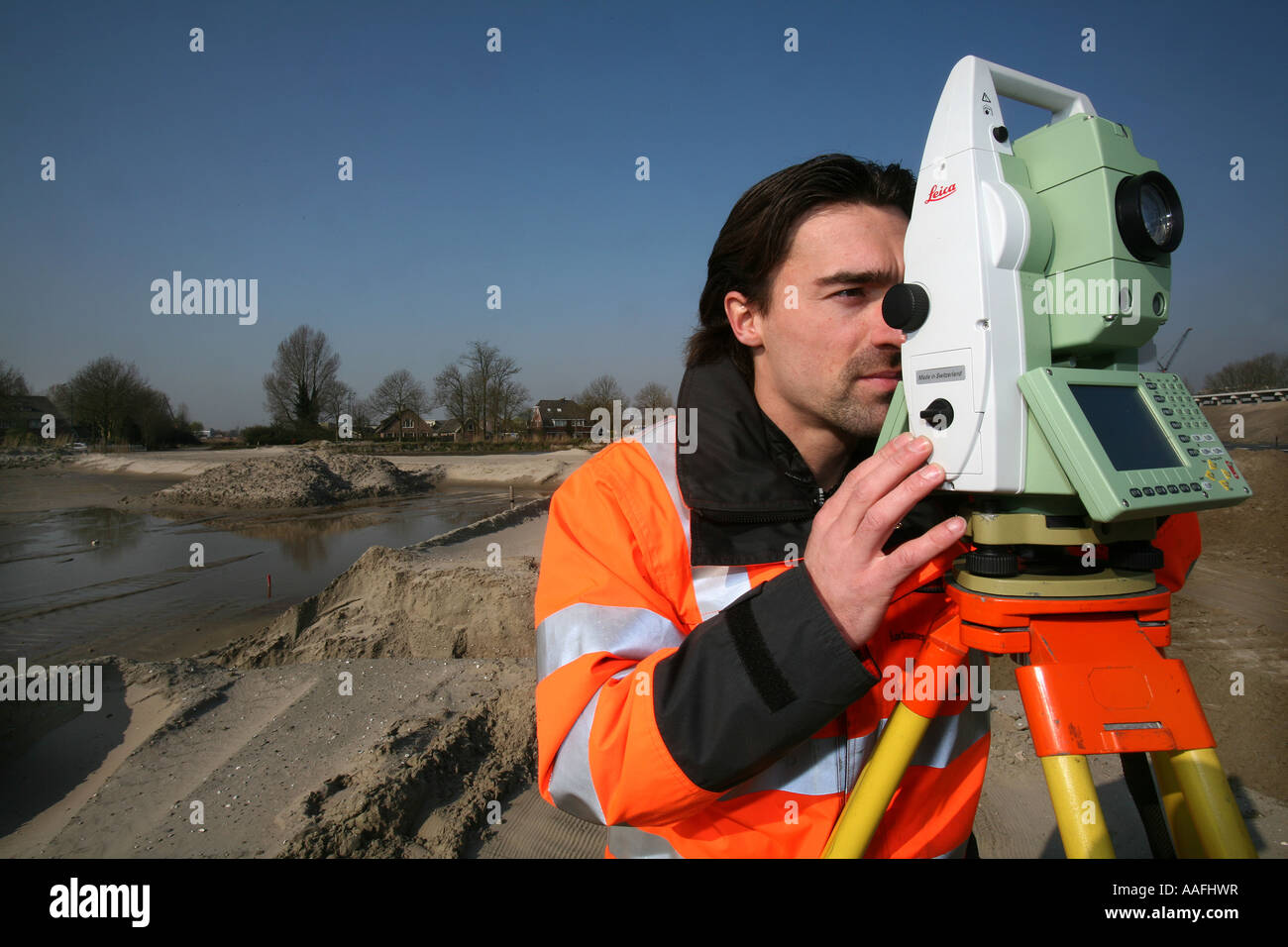 Surveyor at work He registers the borders of land properties editorial ...