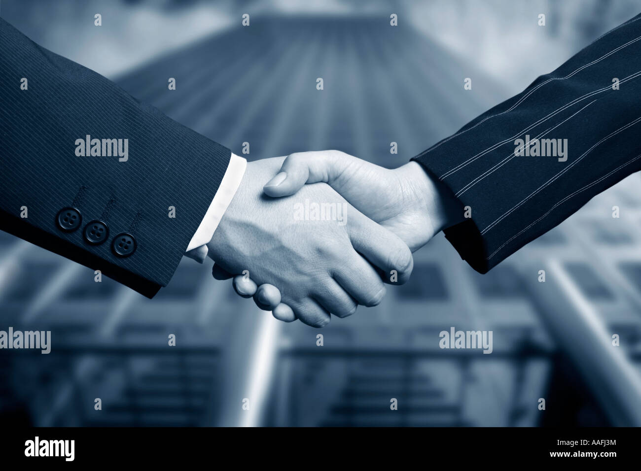 Hand shake with buildings hi-res stock photography and images - Alamy