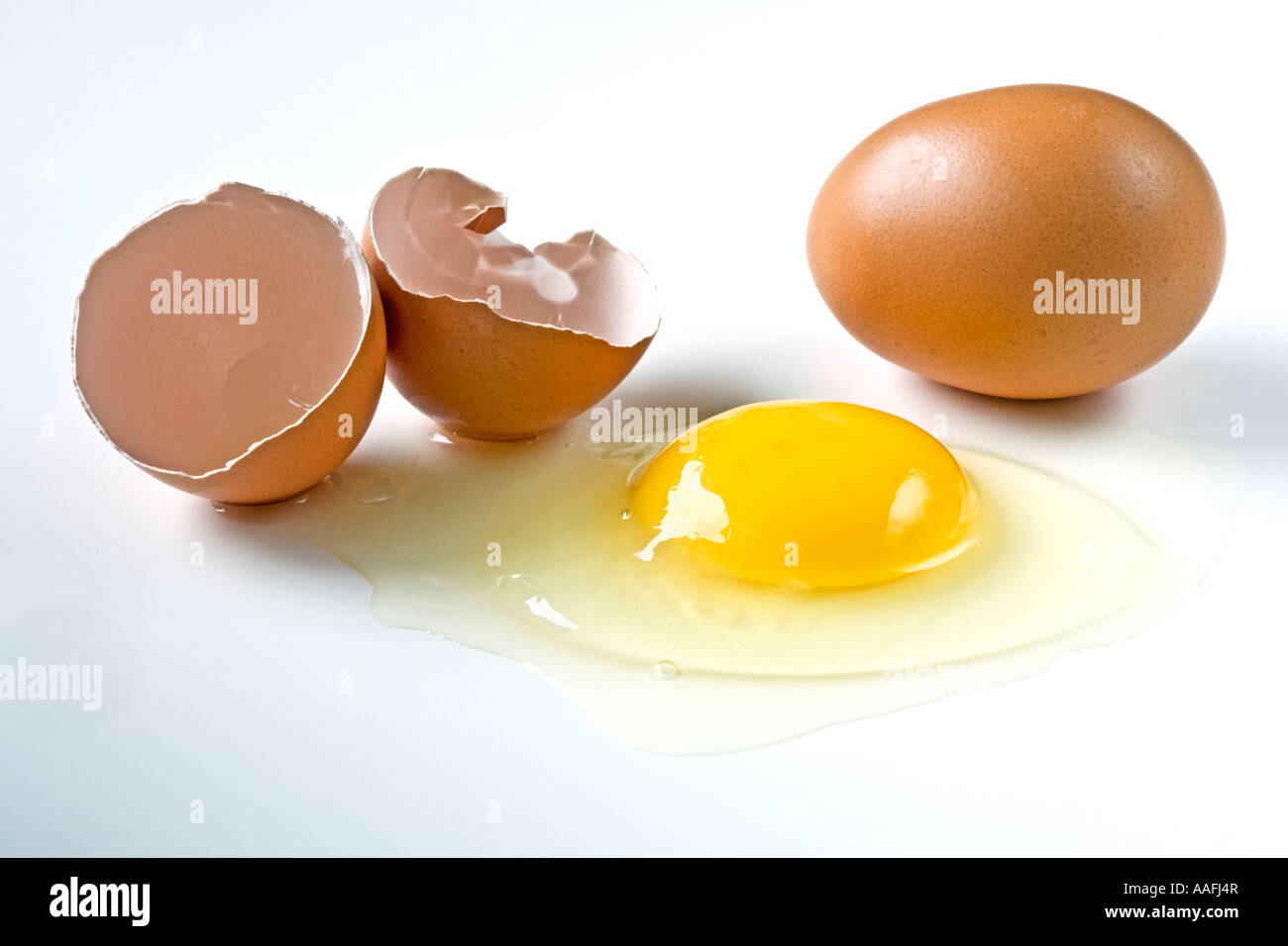 One broken, one whole egg Stock Photo - Alamy