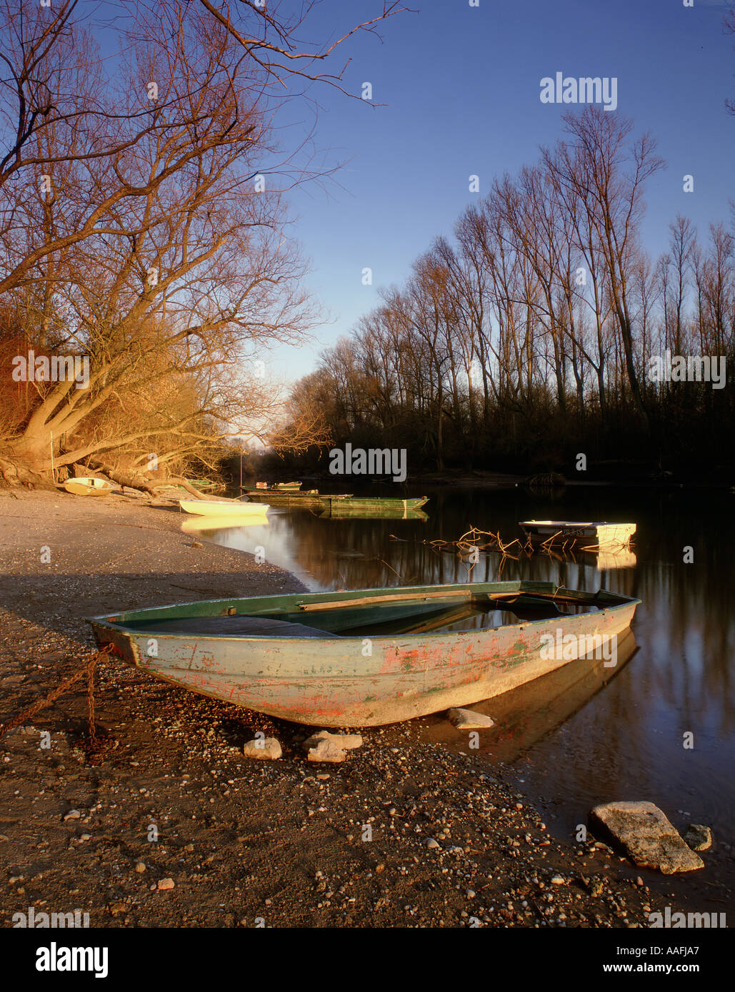 fishing dinghy in evening light Stock Photo - Alamy
