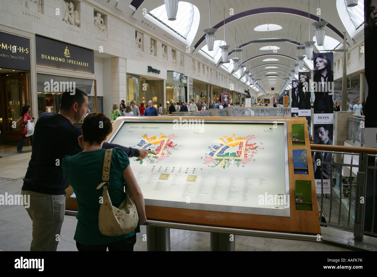 Shoppers using orientation table and store directory at the Bluewater ...