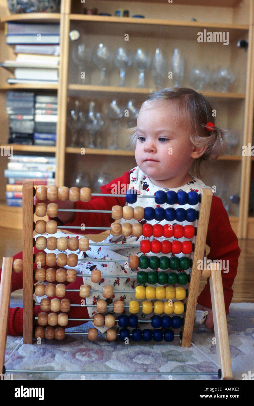 child playing with an abacus Stock Photo - Alamy