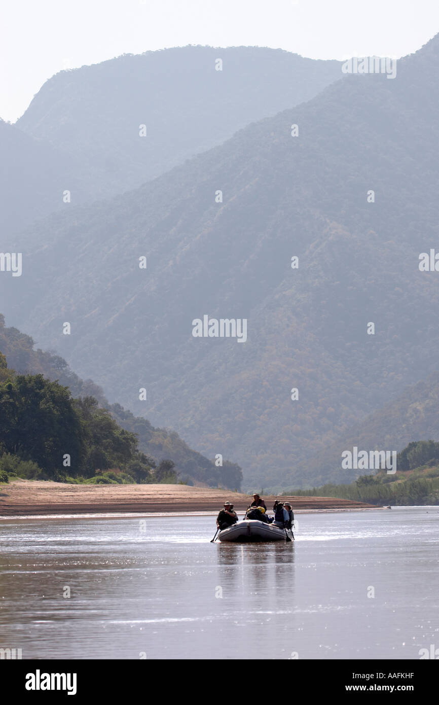 People white water rafting on calm tranquil Blue Nile river water in ...