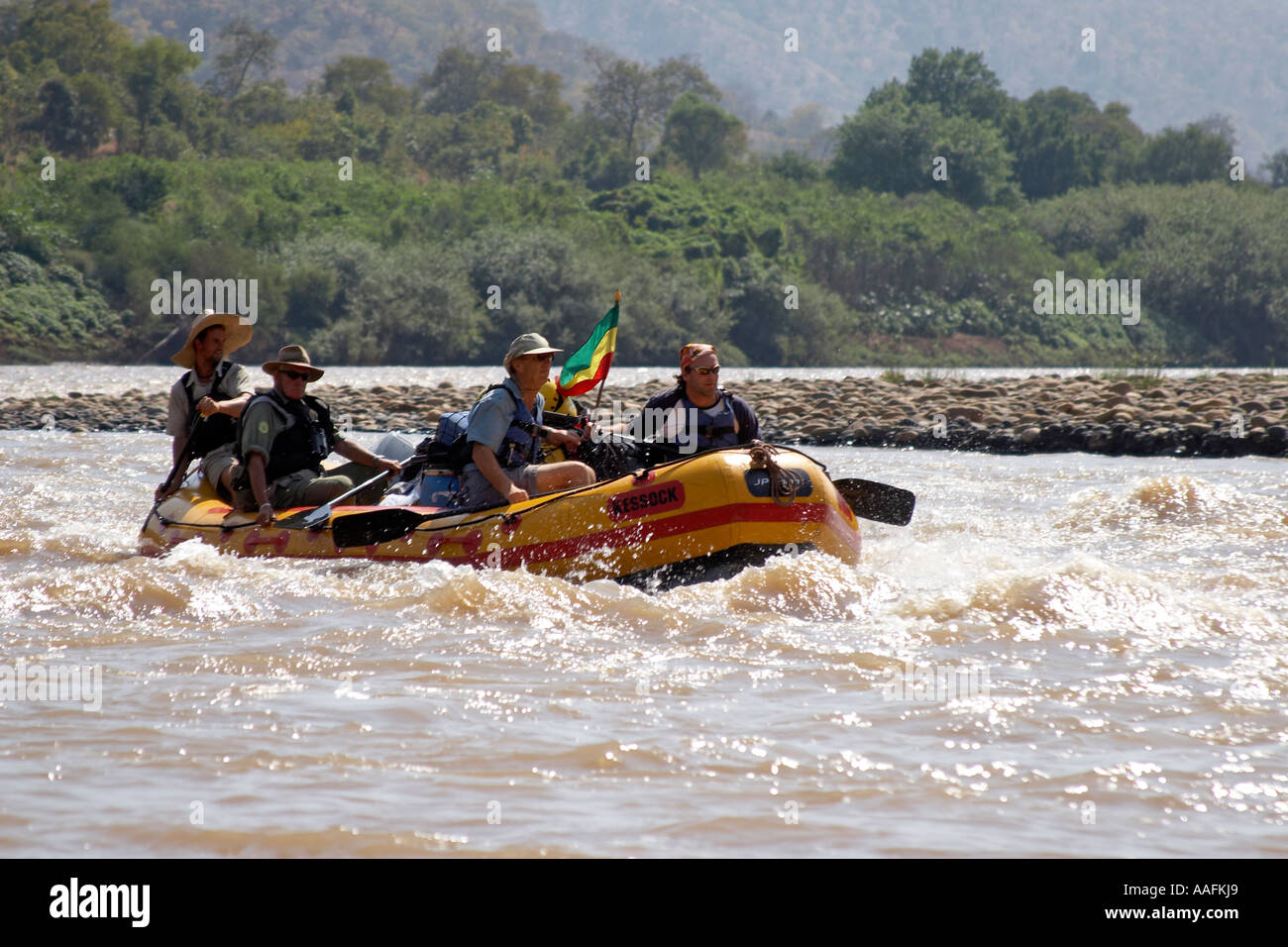 People white water rafting through cataracts or rapids on rough Blue ...