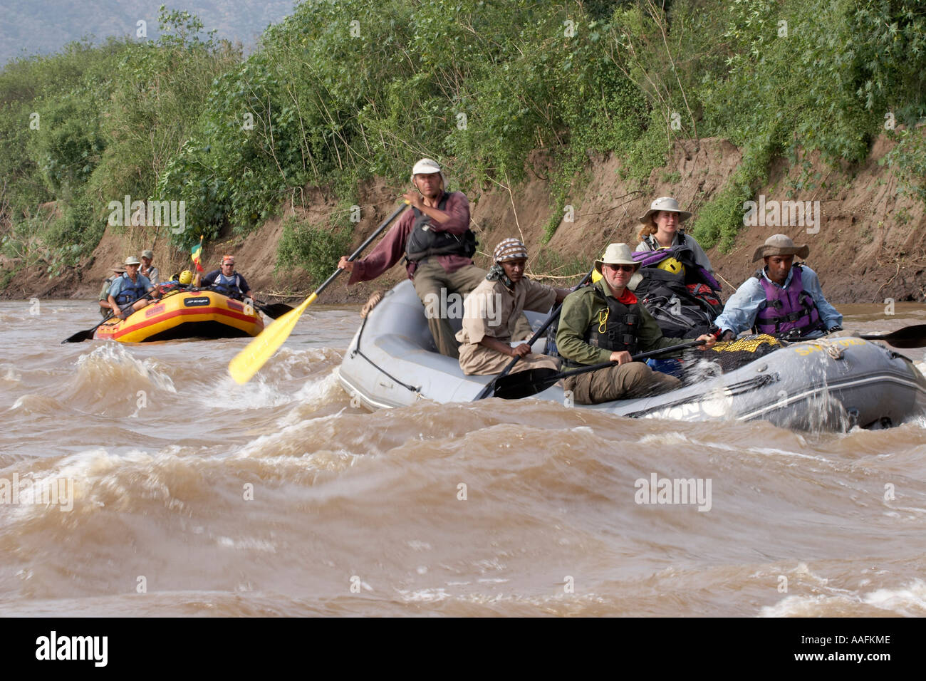 People white water rafting through cataracts or rapids on rough Blue ...