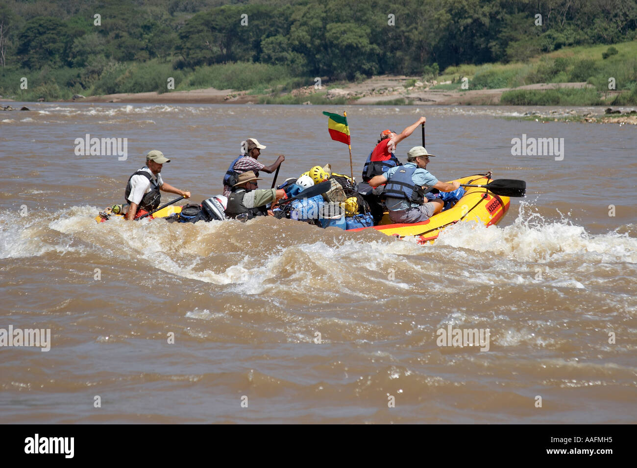 People white water rafting through cataracts or rapids on rough Blue ...