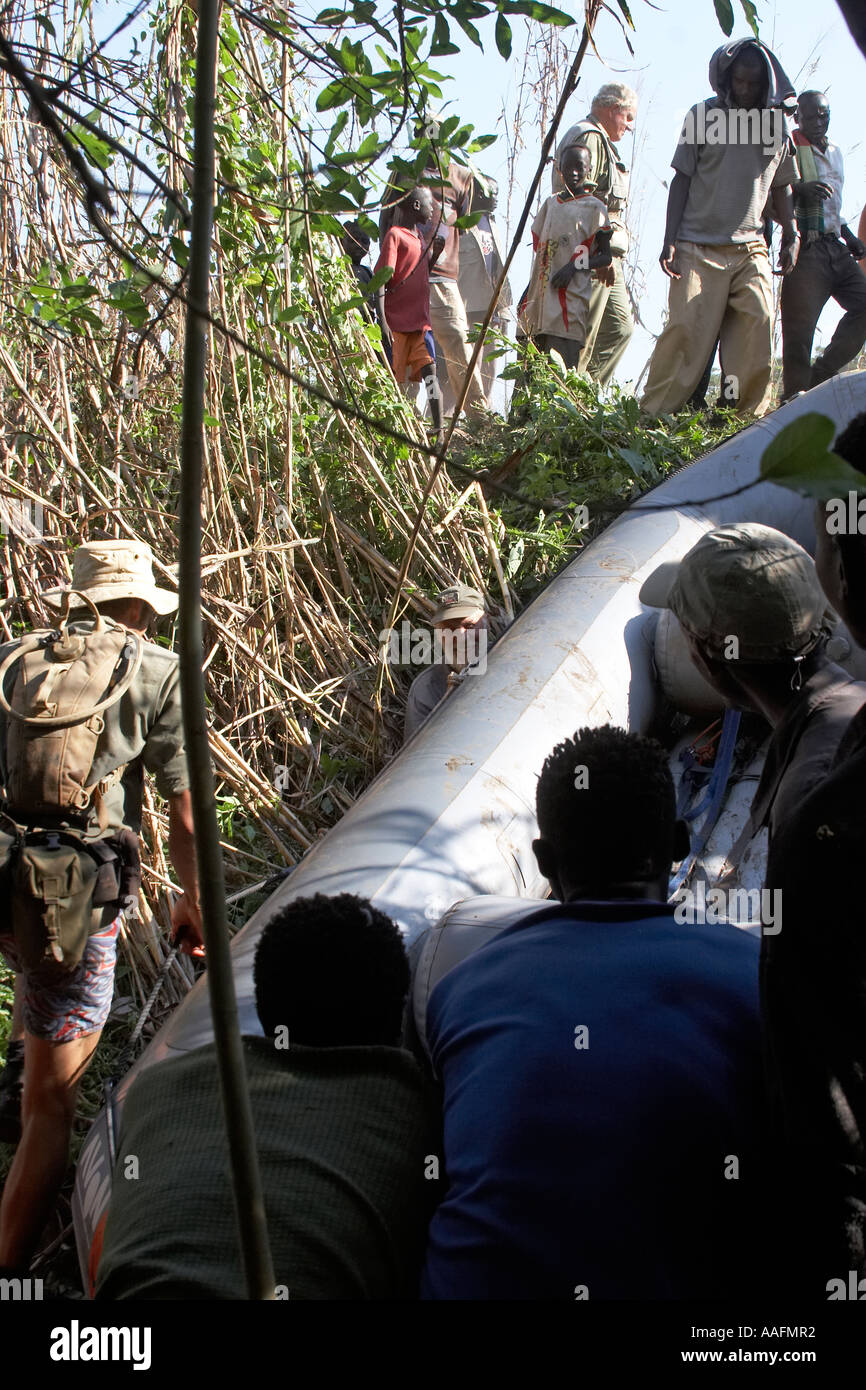 People hauling up inflatable boat over smiling Pat Troy on SES ...