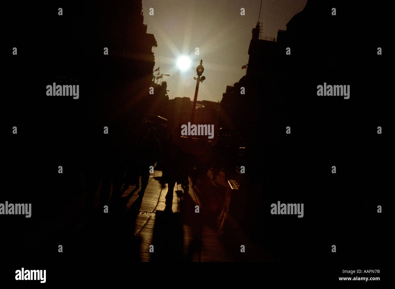 A group of people on their way home in london uk as silhouette Stock ...