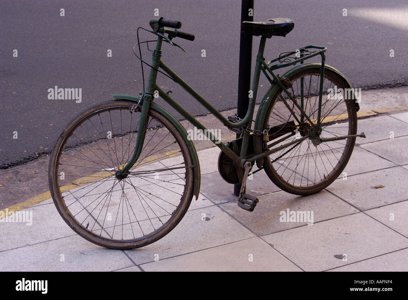 old bycicle leaned Stock Photo - Alamy