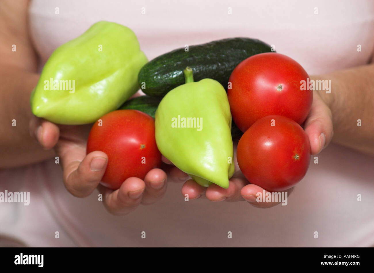 Female hands holding fresh vegetables Stock Photo - Alamy