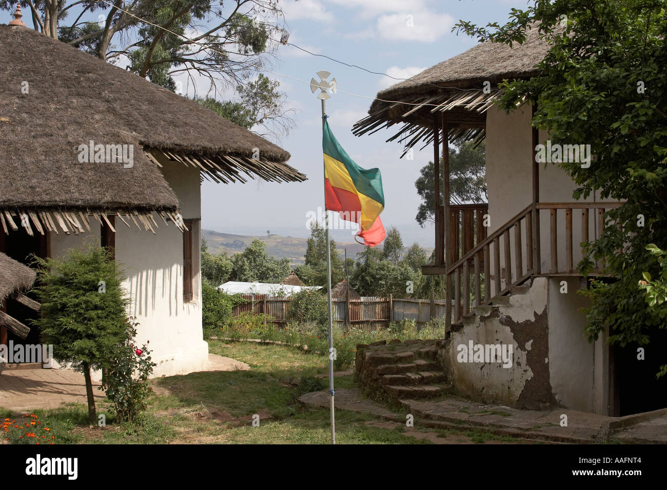 Emperor Menelik s old Palace with Ethiopian flag in Entoto hills above ...