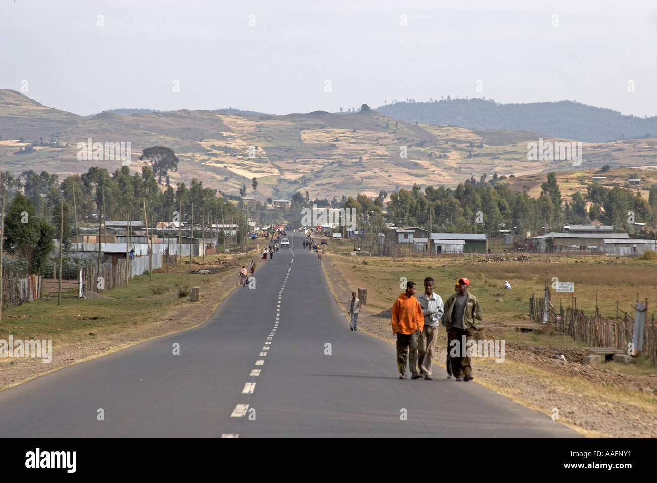 People and donkeys walking on the road from Addis Ababa to Shafartak ...