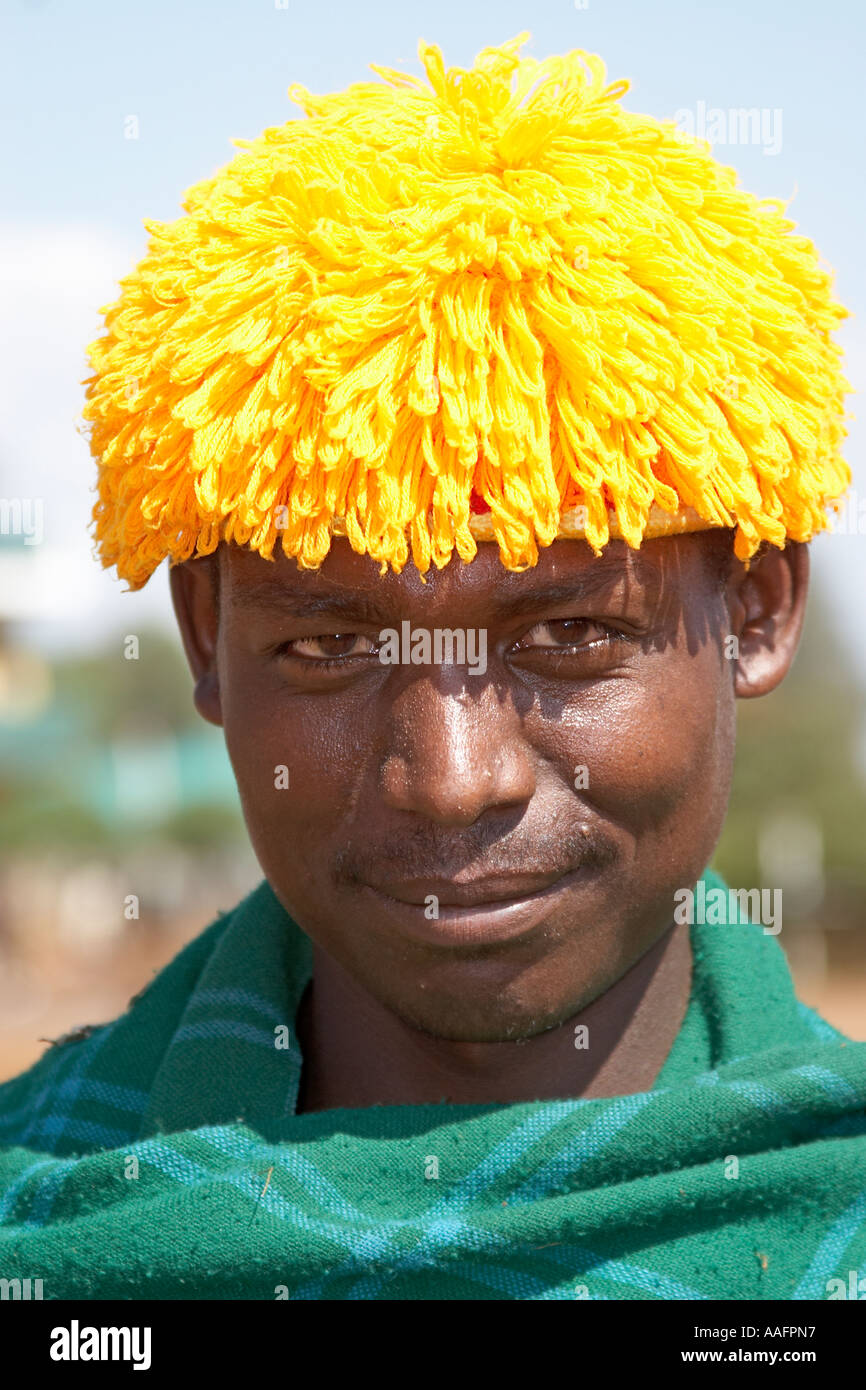 Young boy or man with unusual colourful hat in Finote Selam Ethiopa Africa Amusing funny comic ...