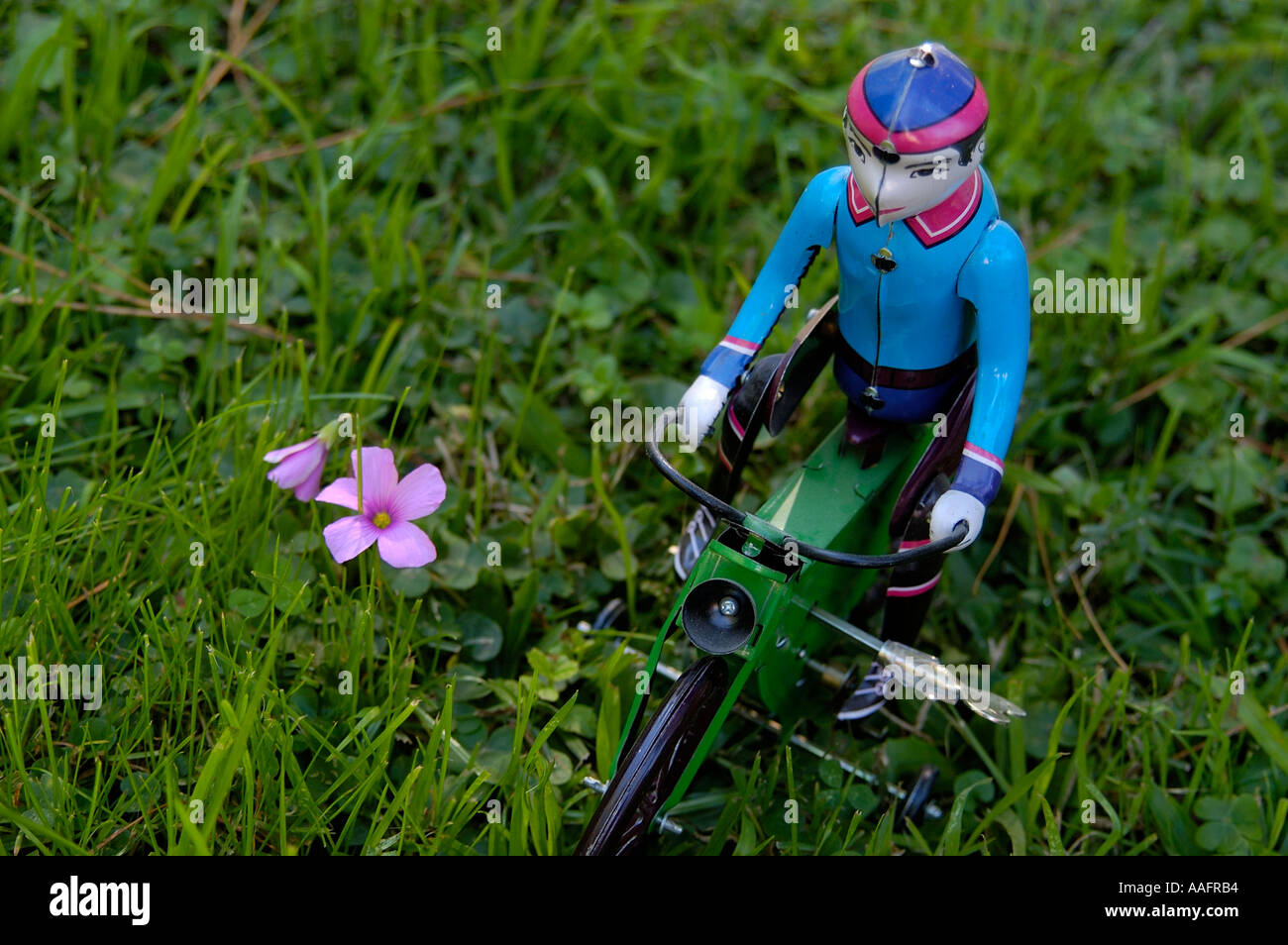Little old mechanic toy on the grass Stock Photo - Alamy