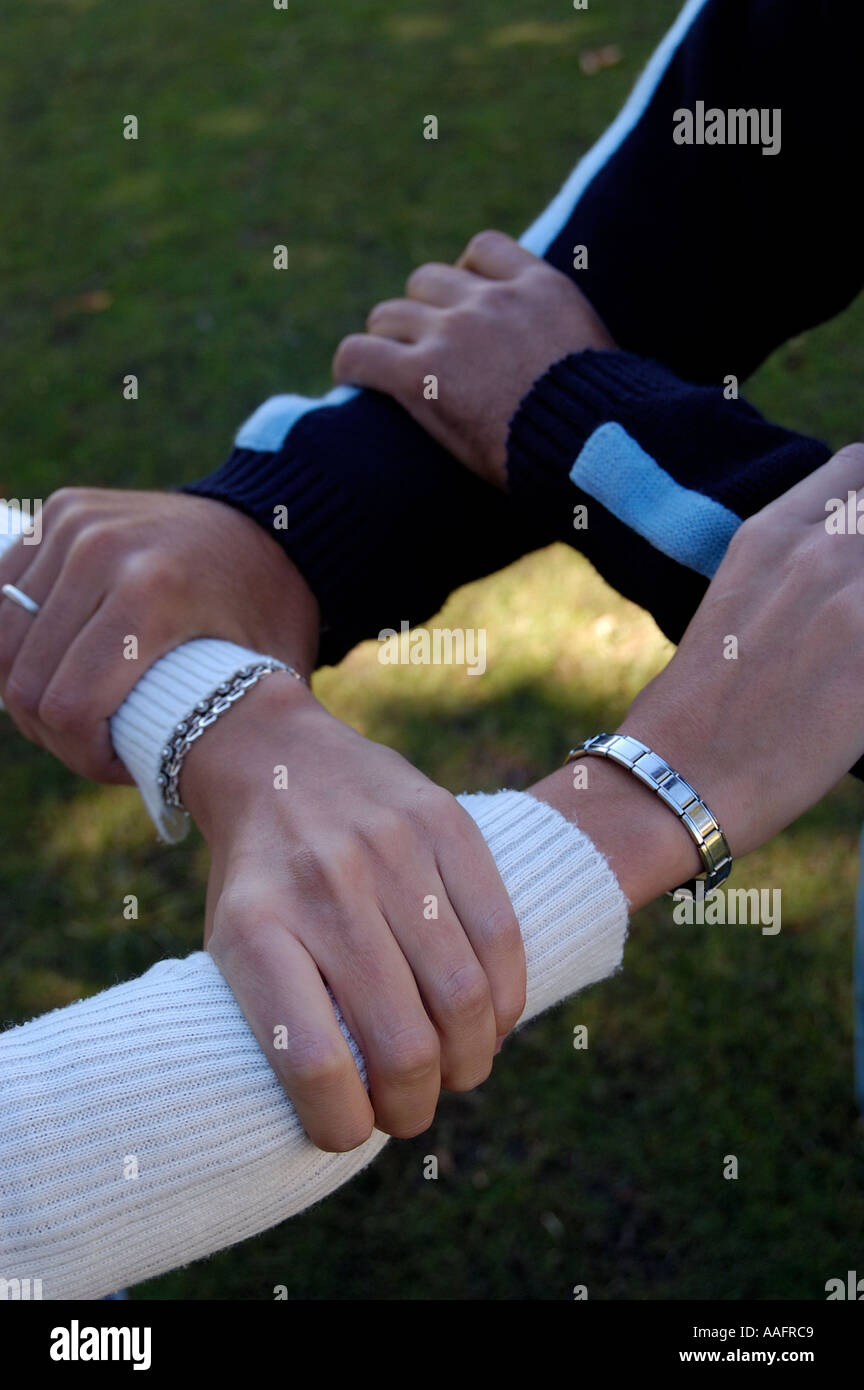 Arms holded one each other Stock Photo - Alamy