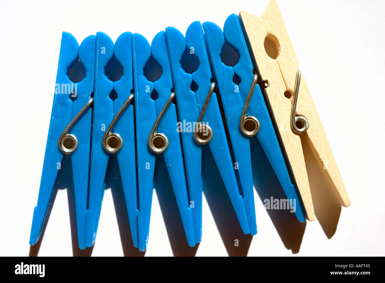 group of pegs with one different and all the group similar Stock Photo ...