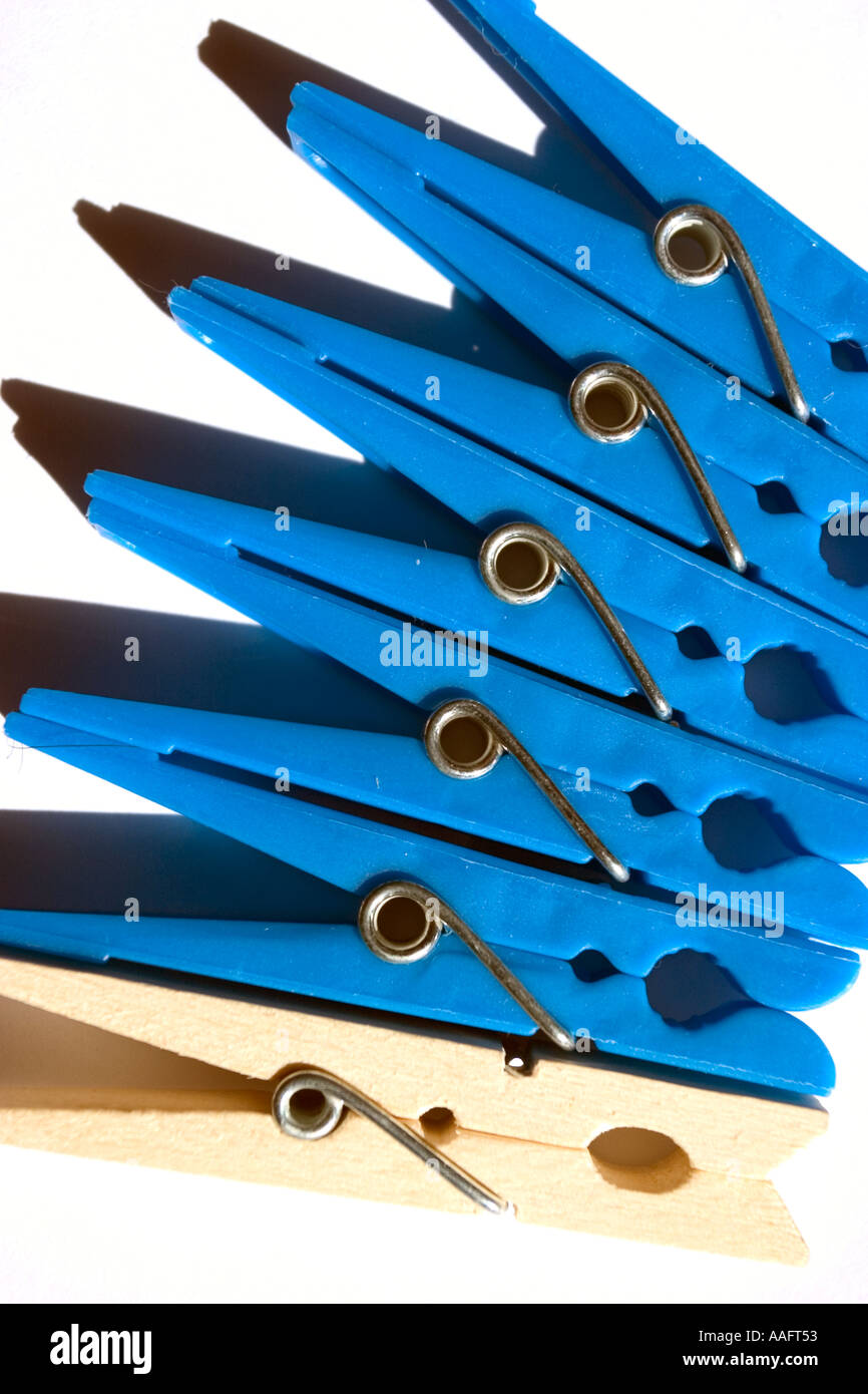 Colored pegs with one different of the similar group Stock Photo - Alamy