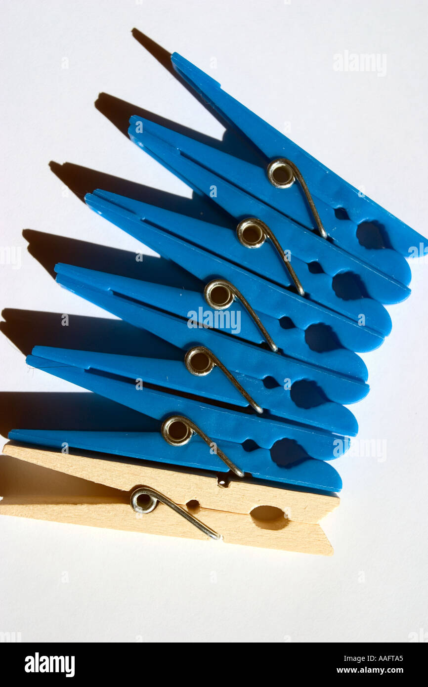 Colored pegs with one different of the similar group Stock Photo - Alamy