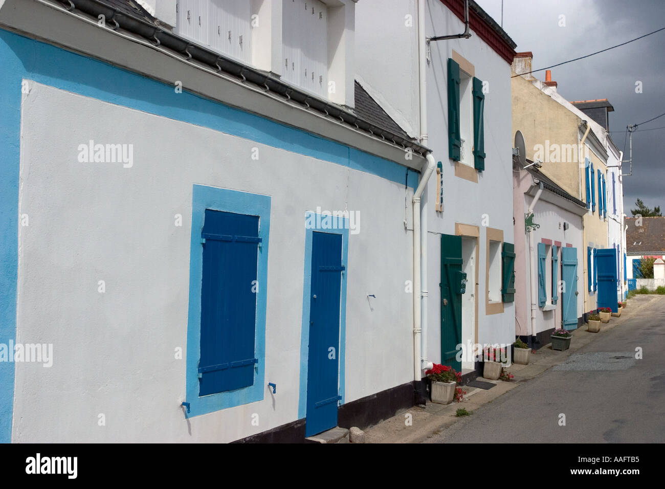 wall frontage of house with blue and white door and window in belle ile ...