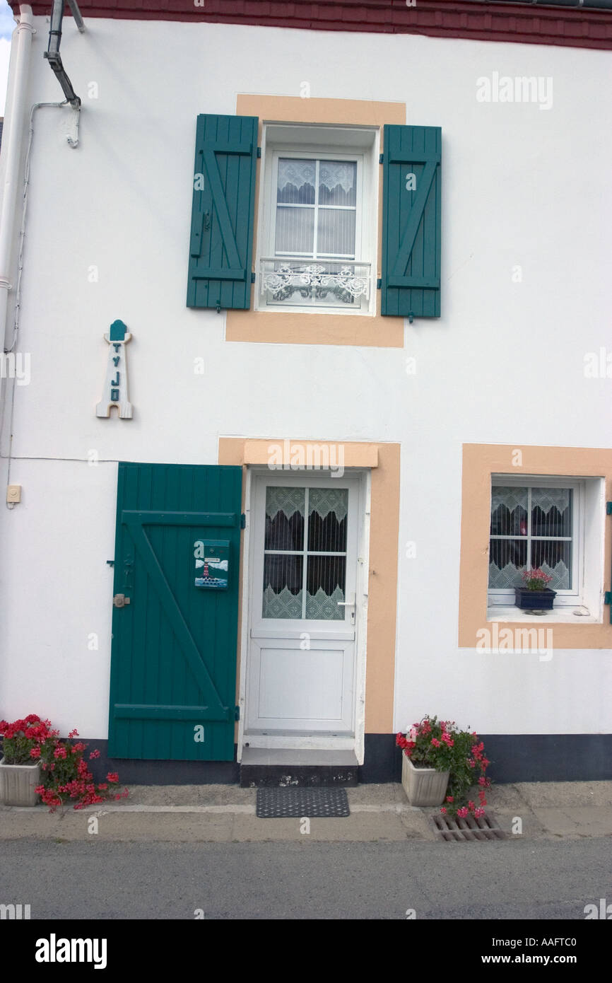 wall frontage of house with blue and yellow door and window in belle ...