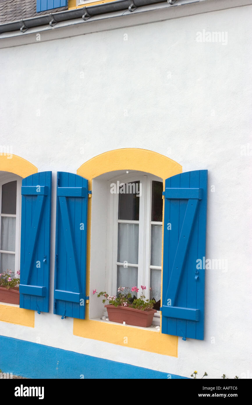 wall frontage of house with blue and yellow window in belle ile france ...