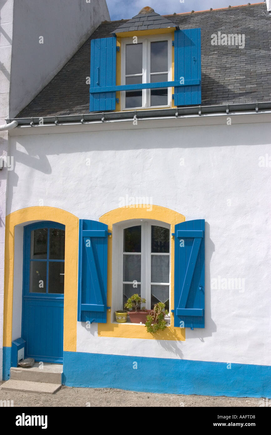 wall frontage of house with blue and yellow door and window in belle ...