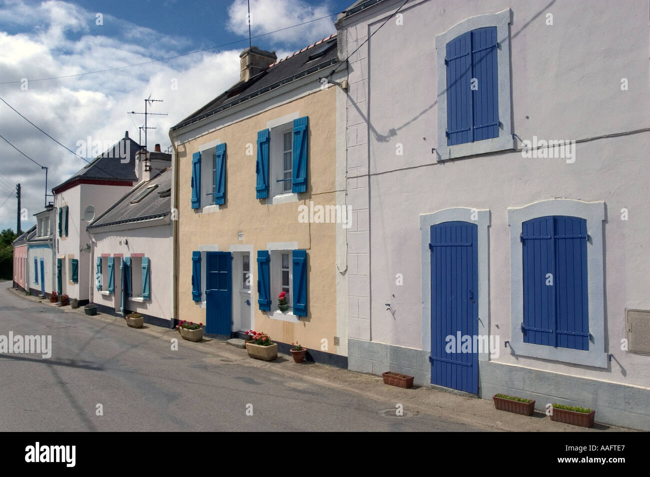 wall frontage of house with blue and yellow door and window in belle ...