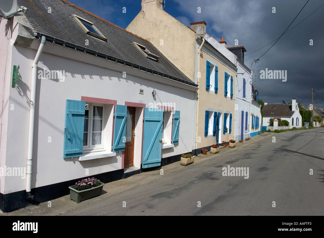 wall frontage of house with blue and white door and window in belle ile ...