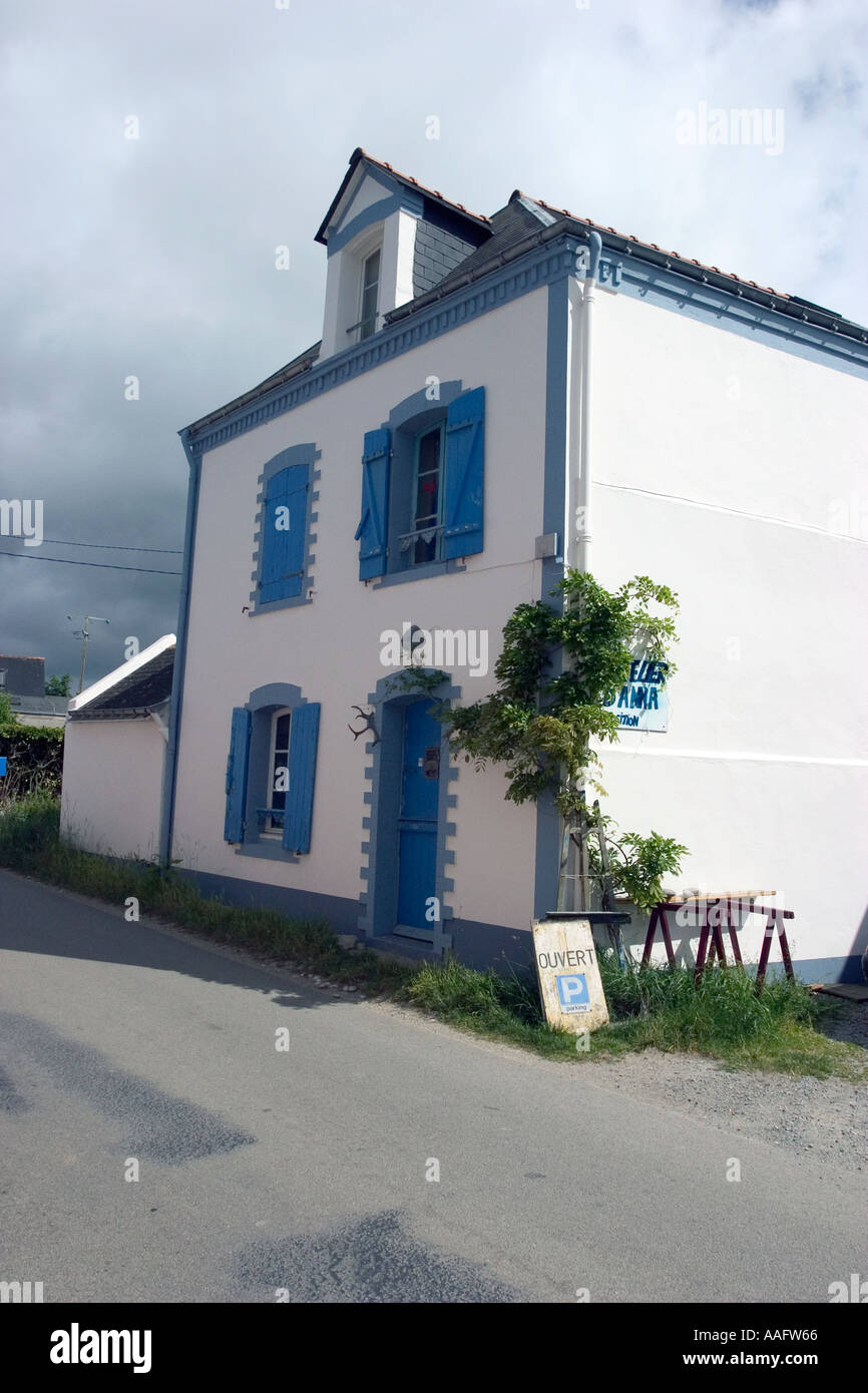 wall frontage of house with blue and white door and window in belle ile ...