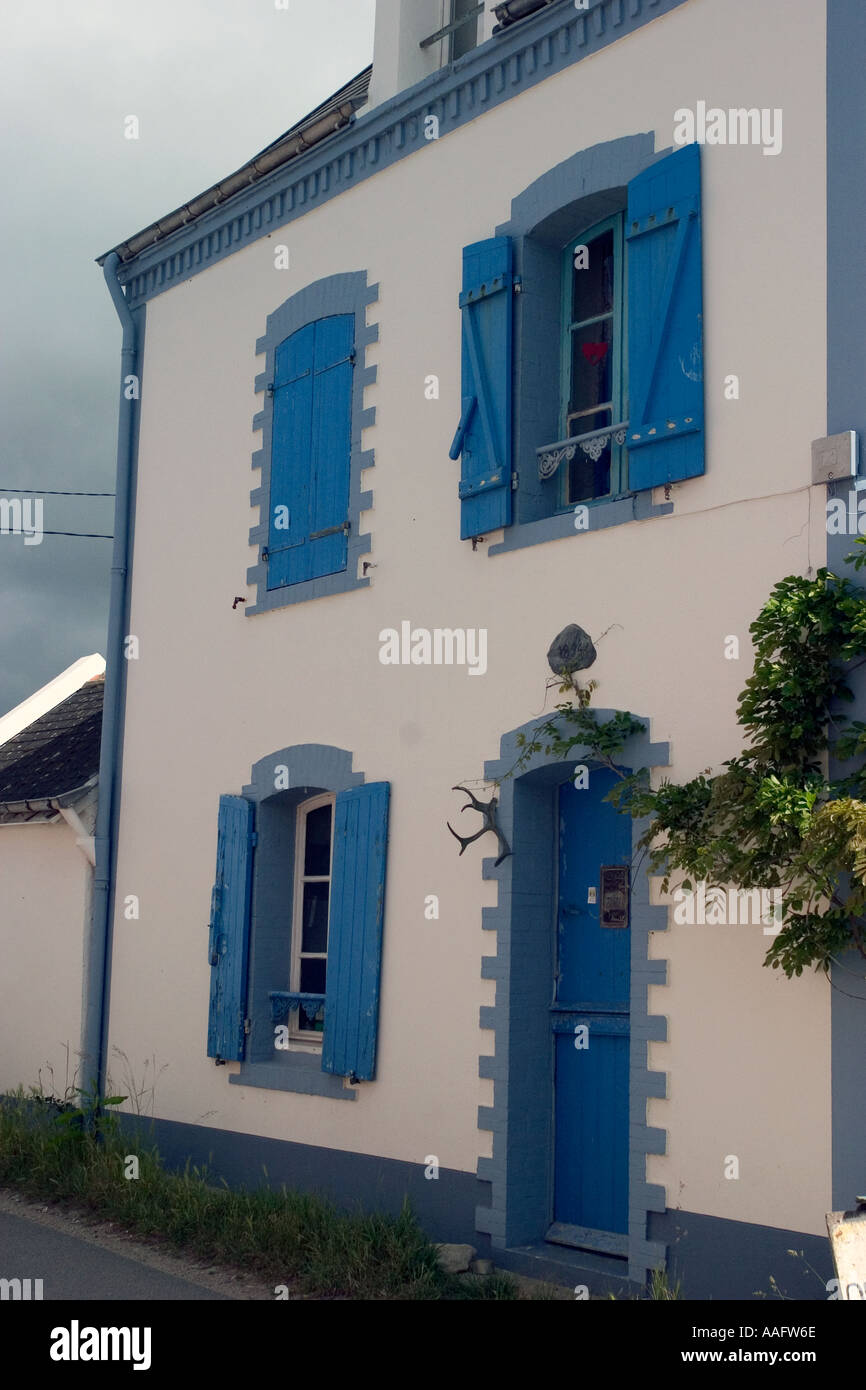 white wall frontage of house with blue windows in belle ile france ...