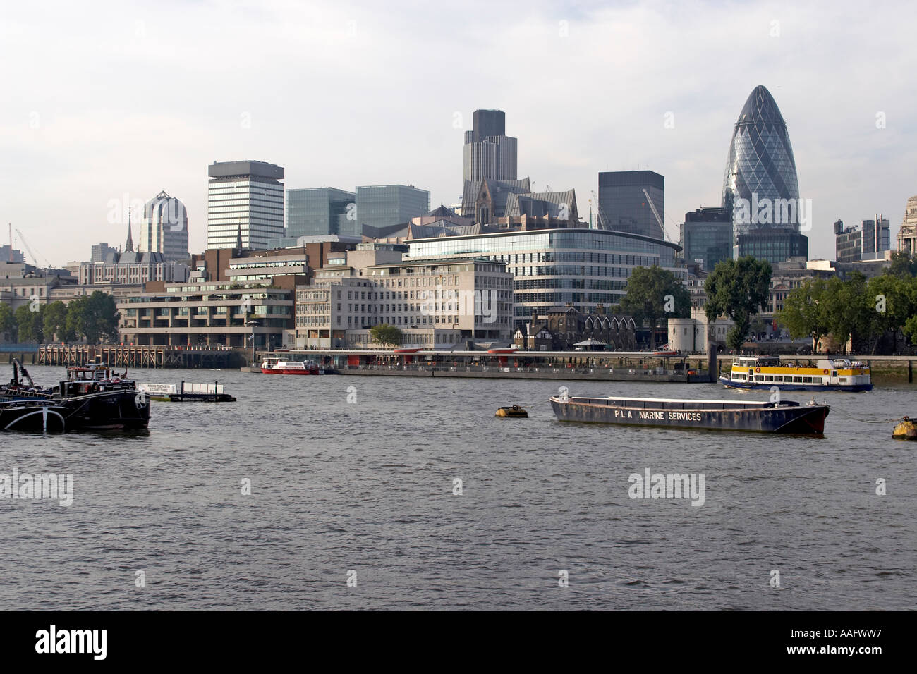 City of London EC3 from Tower Bridge with River Thames and barges ...