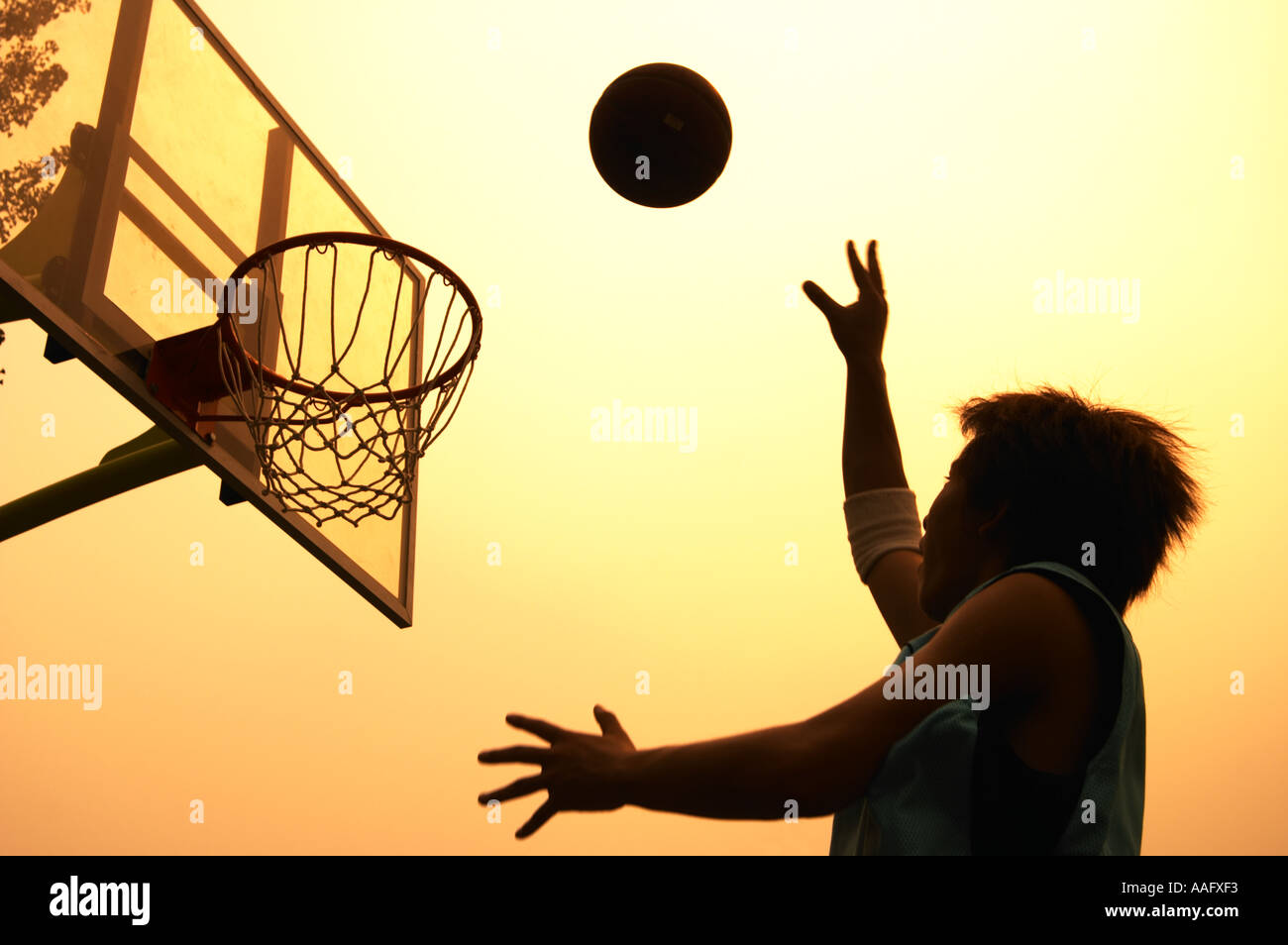 Asian man playing basketball Stock Photo - Alamy