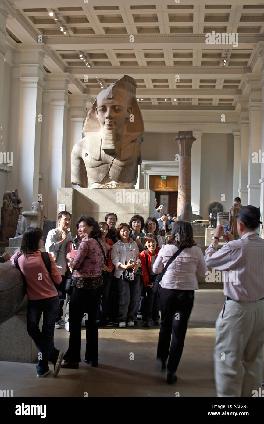 Visitors or tourists in Ancient Egypt gallery with historic items or ...