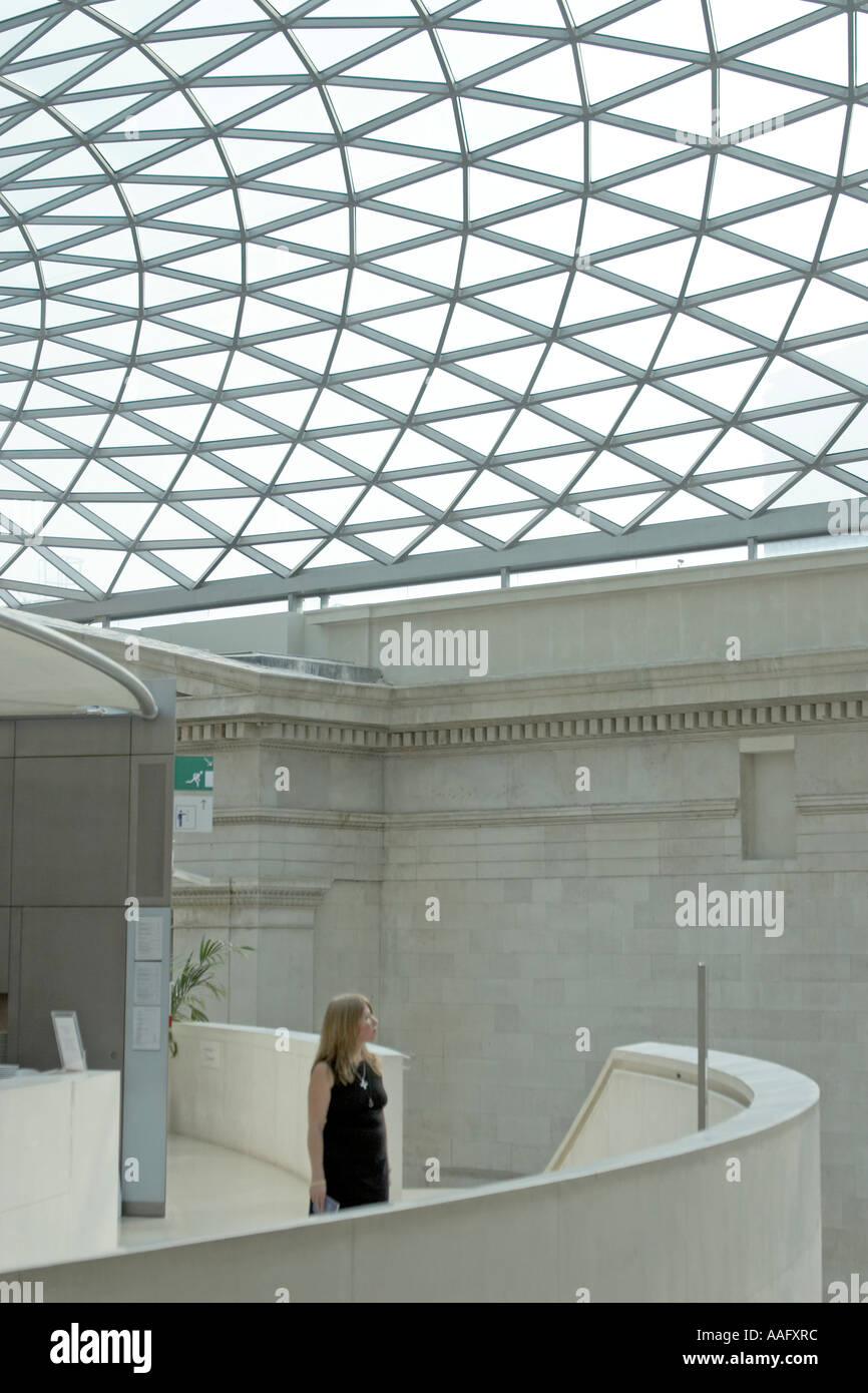 Woman looking at new glass roof above atrium of the British Museum ...