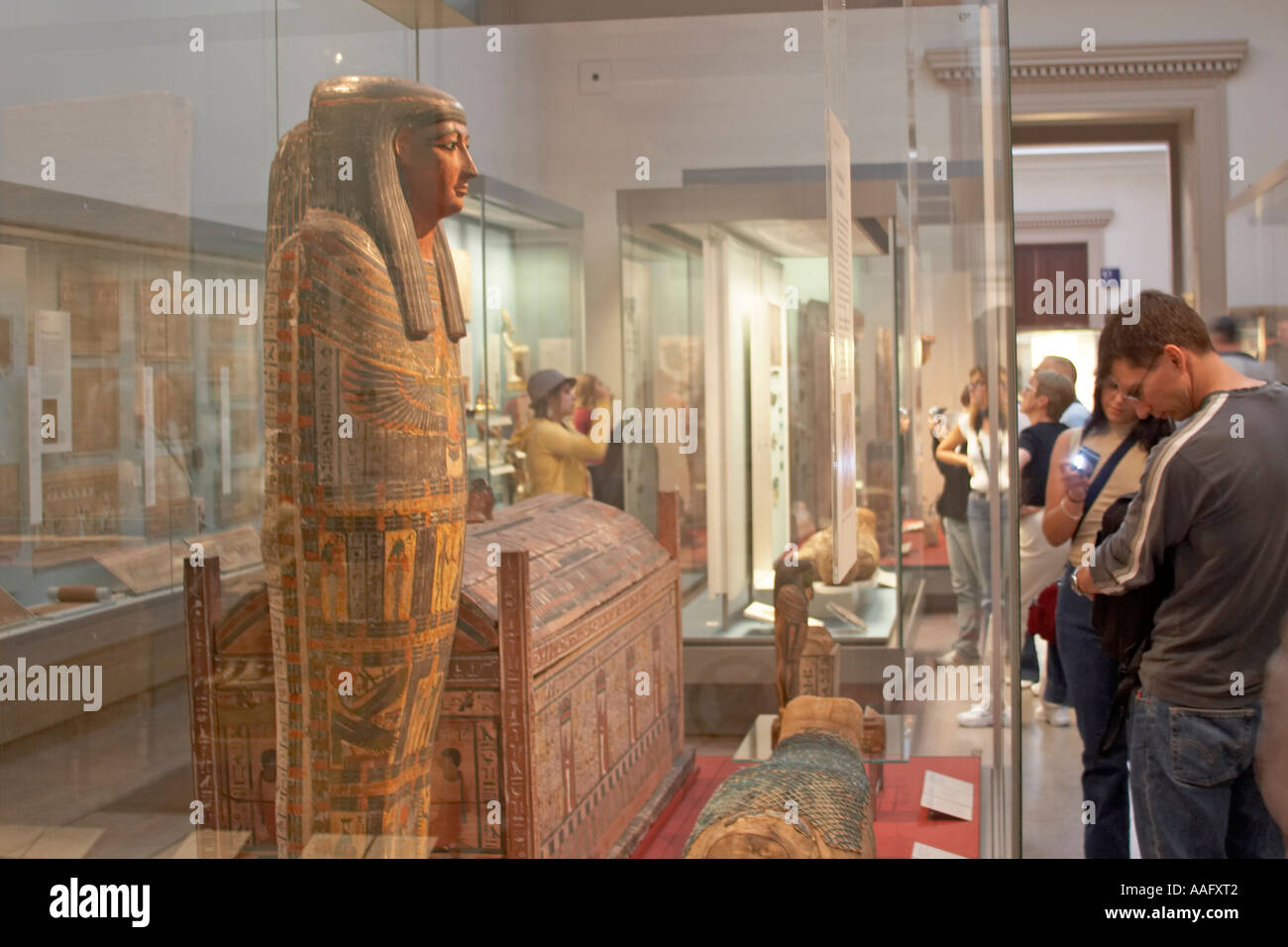 People visitors looking at Egyptian historic items or objects on ...