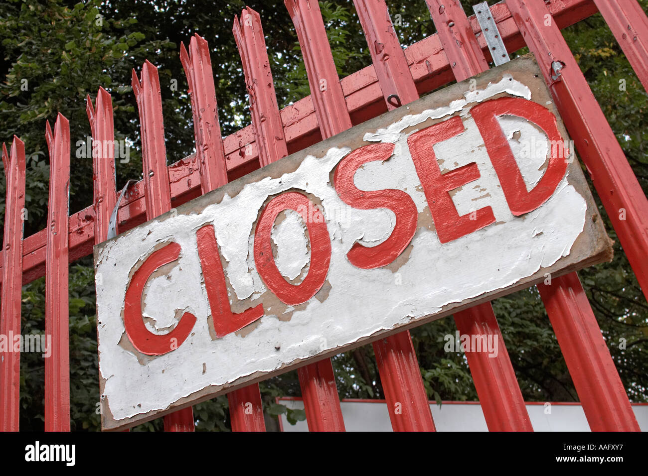 Dilapidated Closed sign notice on a red gate with red letters Stock ...