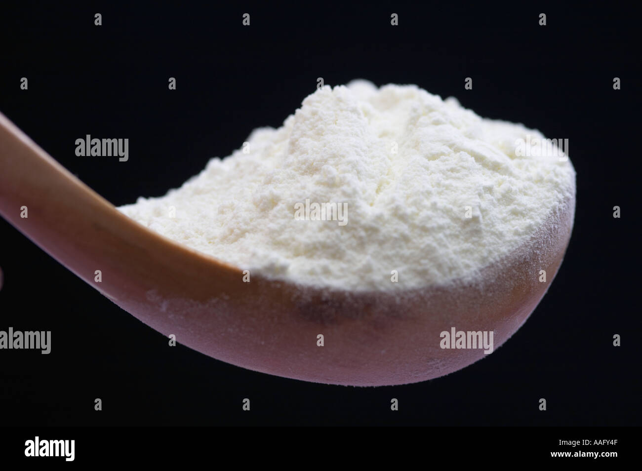 Spoonful of powdered milk Stock Photo - Alamy