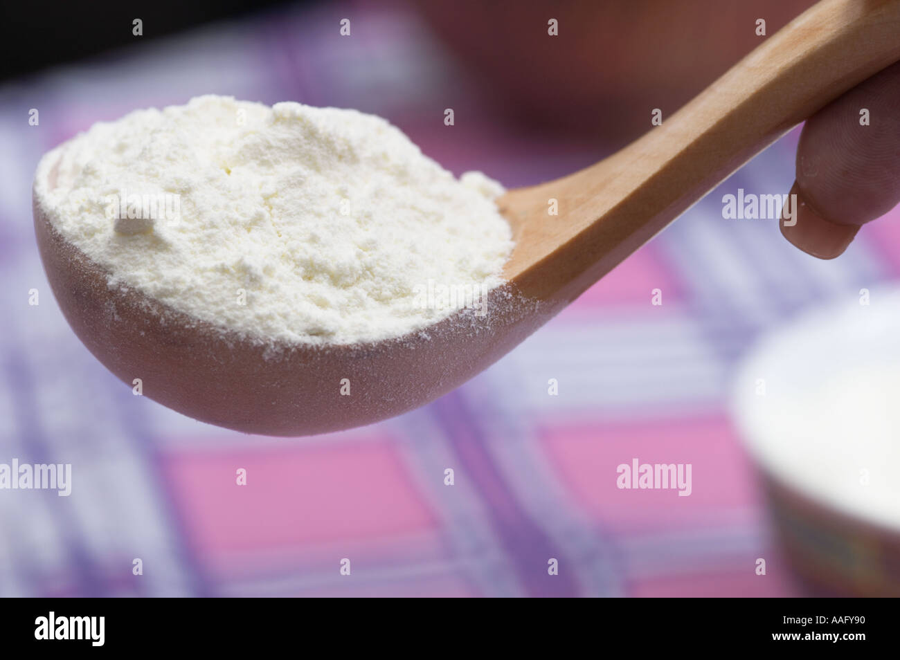 Spoonful of powdered milk Stock Photo - Alamy