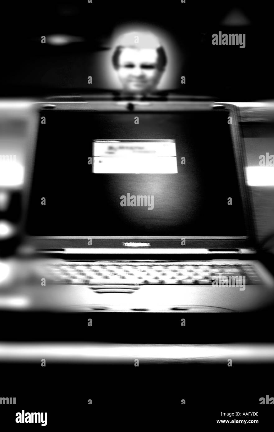 face suspended above laptop computer Stock Photo - Alamy