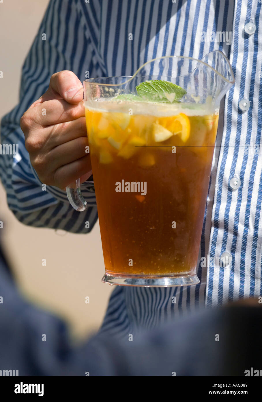 Man carrying a jug of cold drink Stock Photo - Alamy