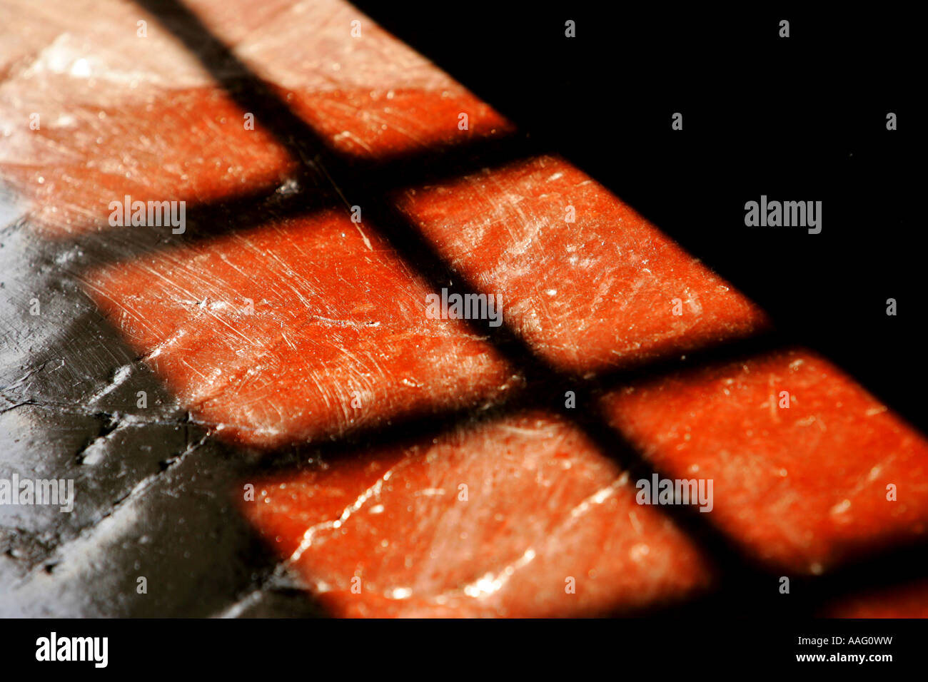 A window reflected across a blood red floor in portugal Stock Photo - Alamy