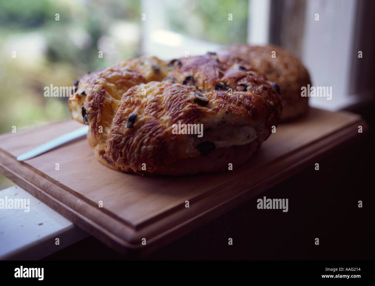 rustic olive loaf on window sill Stock Photo - Alamy