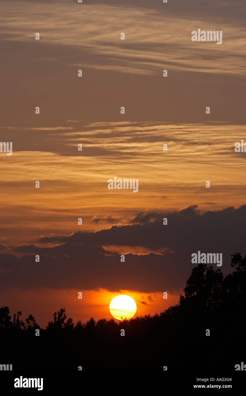Sun setting in dramatic orange sunset in Entoto hills Stock Photo - Alamy